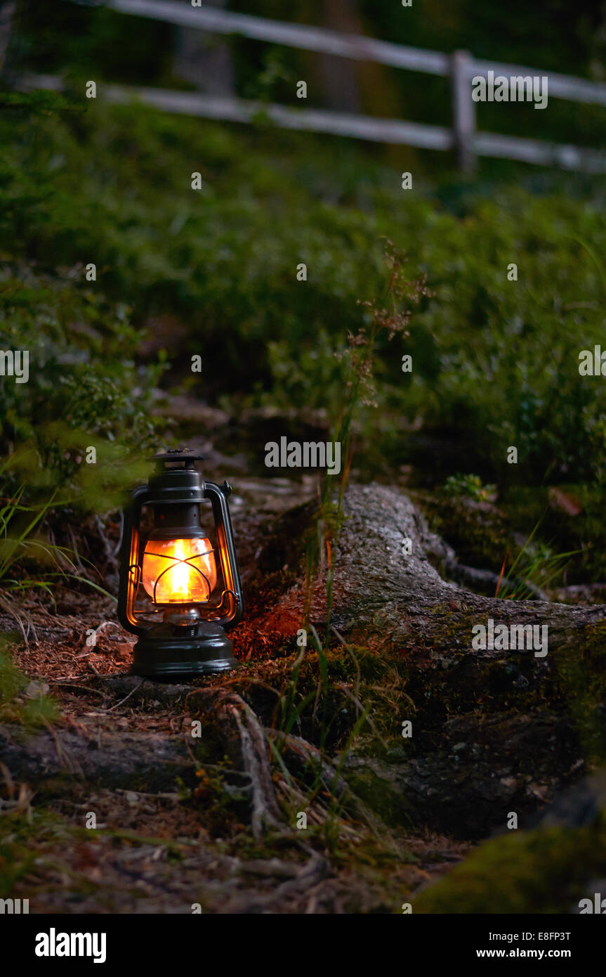 Illuminated oil lamp in field Stock Photo - Alamy