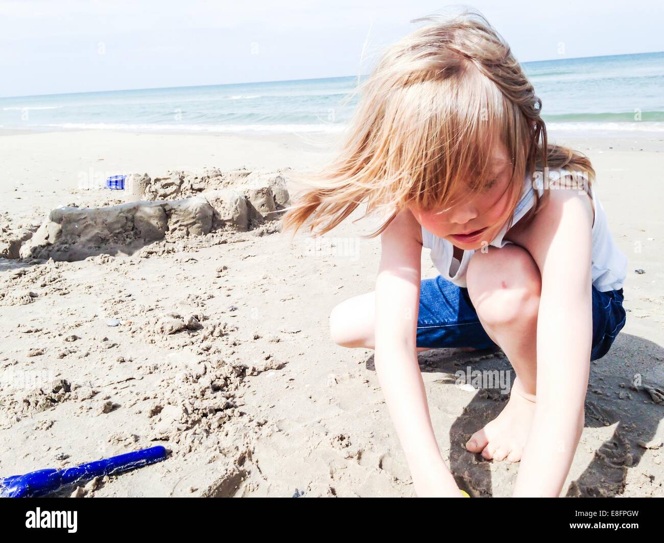 Boy building sandcastle on beach hi-res stock photography and images ...