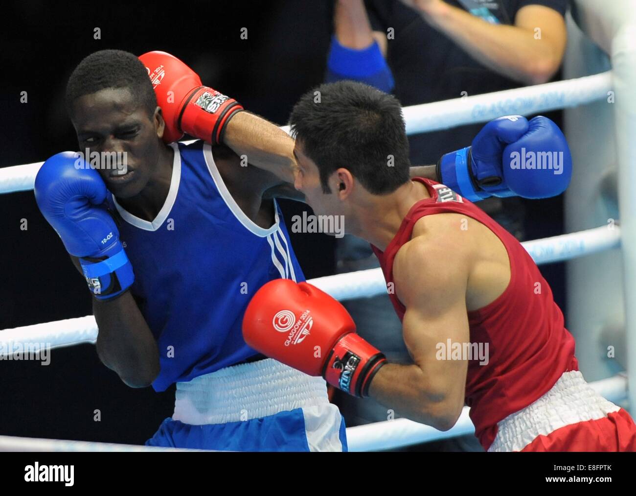 Muhammad Waseem (PAK, red) and Abdul Omar (GHA). Mens 52Kg. Boxing ...