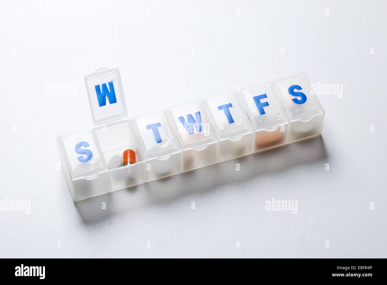 Weekly pill box Stock Photo - Alamy
