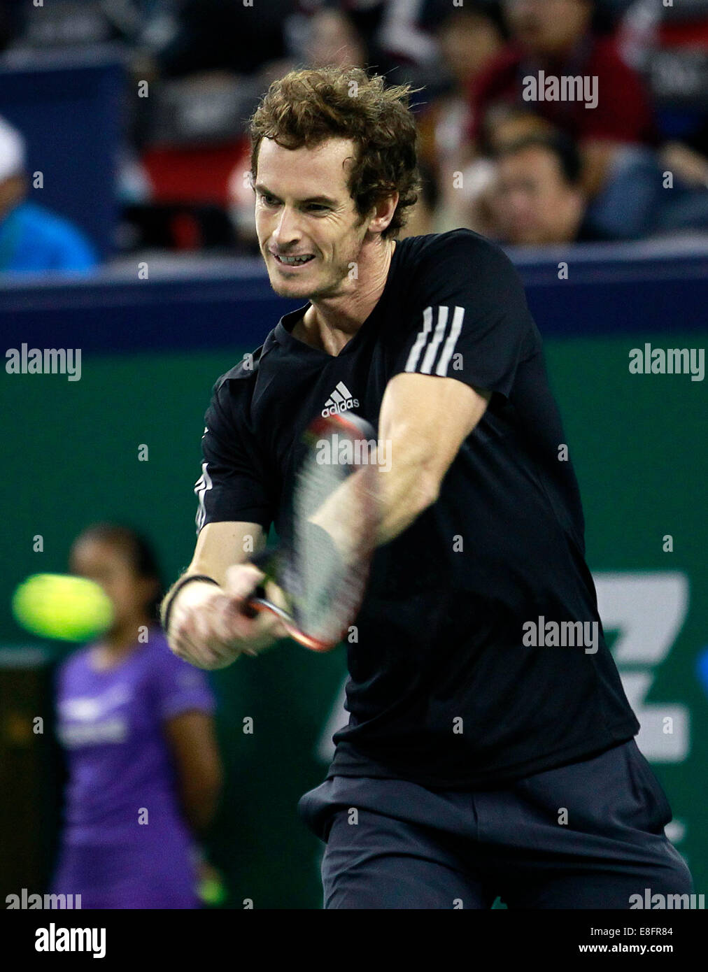 Shanghai, China. 7th Oct, 2014. Britain's Andy Murray returns the ball during the men's singles ...