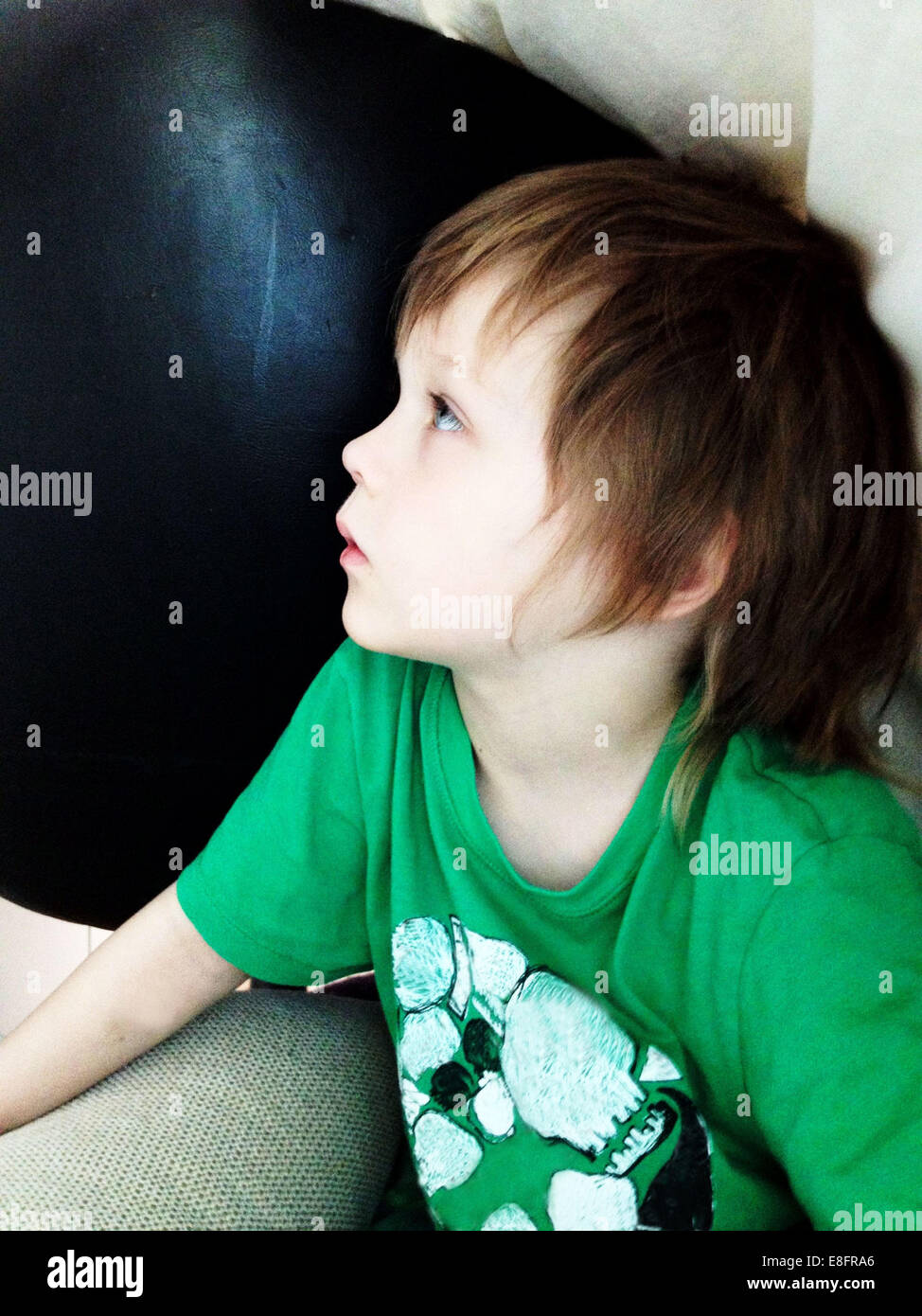 Portrait of a boy looking up Stock Photo - Alamy