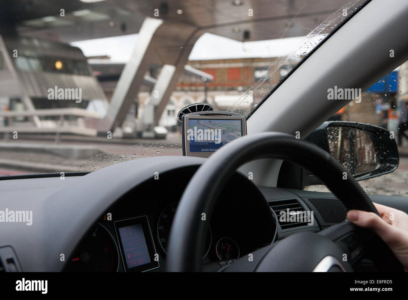 Person using car global positioning system to navigate city Stock Photo ...