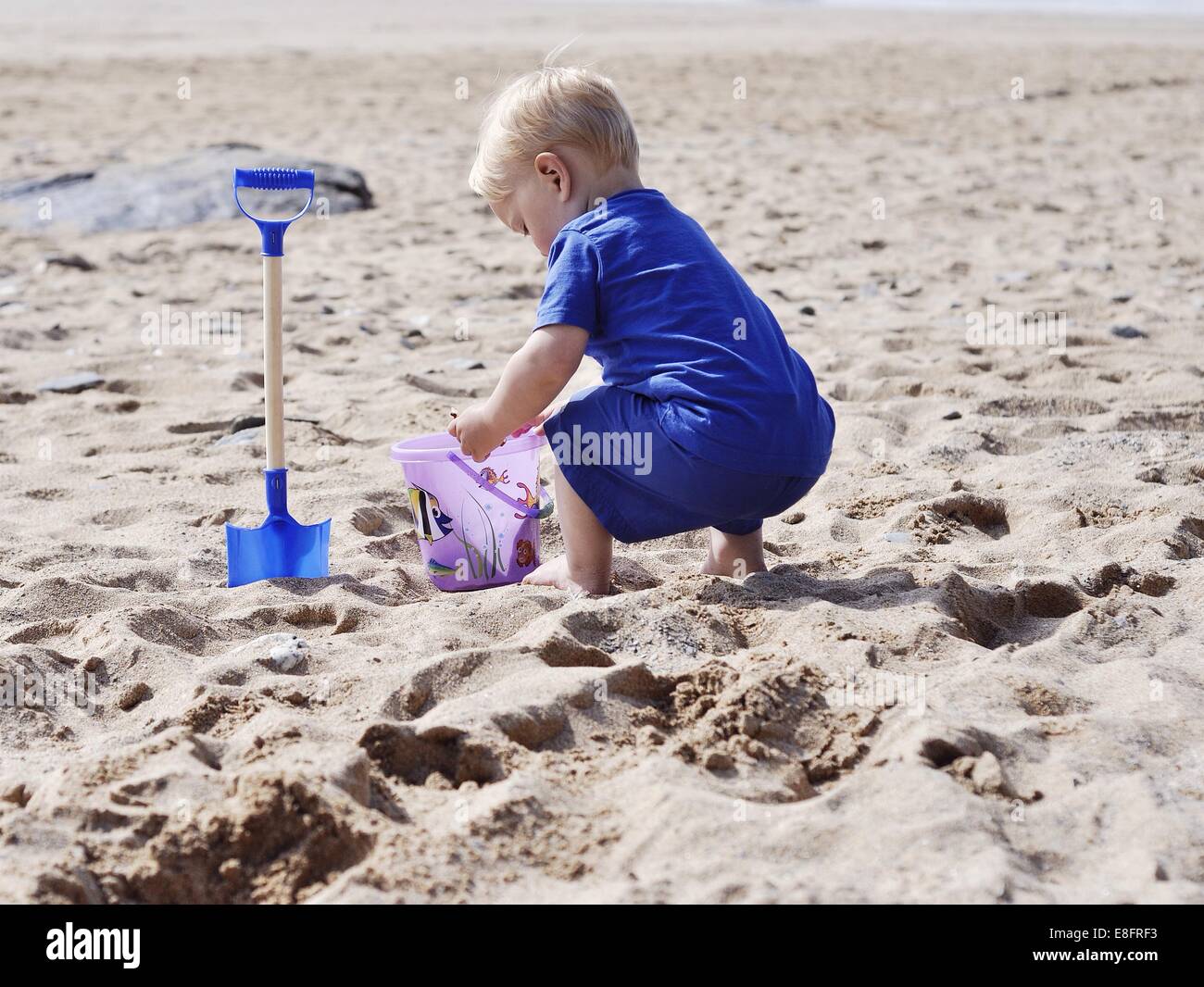 Boy building sandcastle on beach hi-res stock photography and images ...