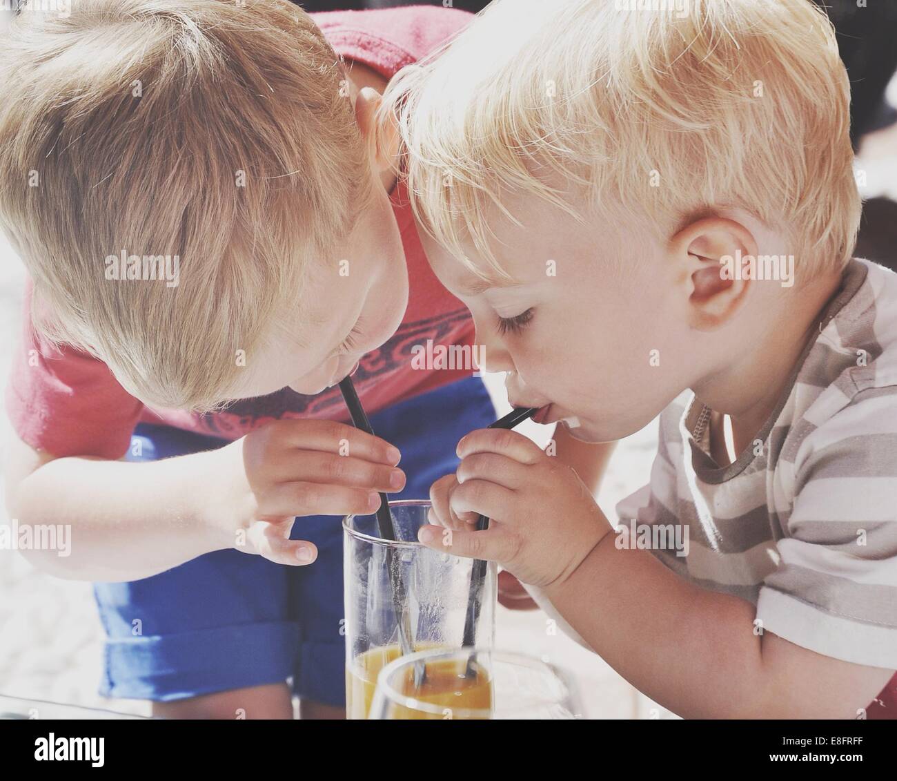 Sharing childhood hi-res stock photography and images - Alamy