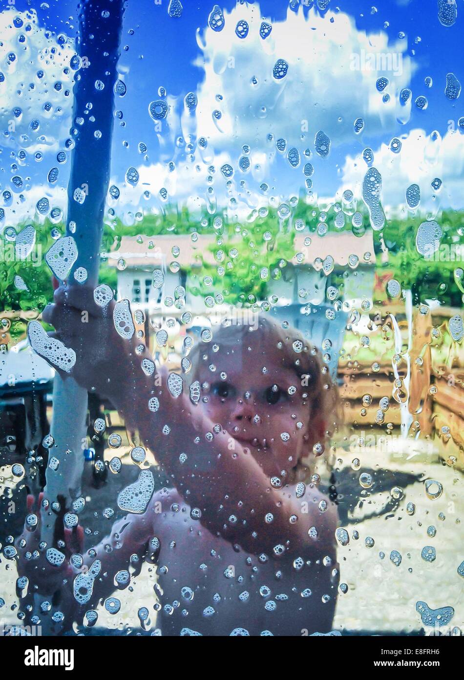 Boy washing windows Stock Photo - Alamy