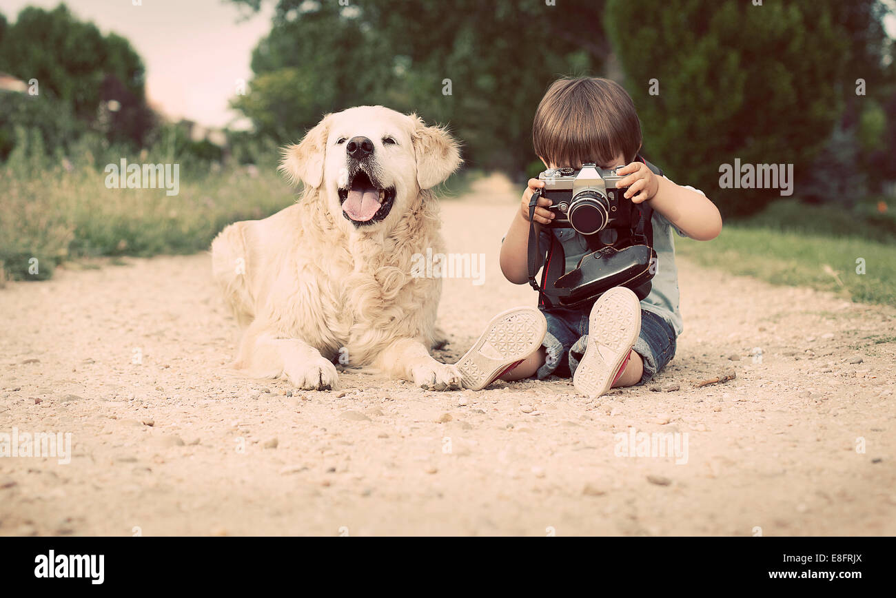 Boy sitting with dog hi-res stock photography and images - Alamy
