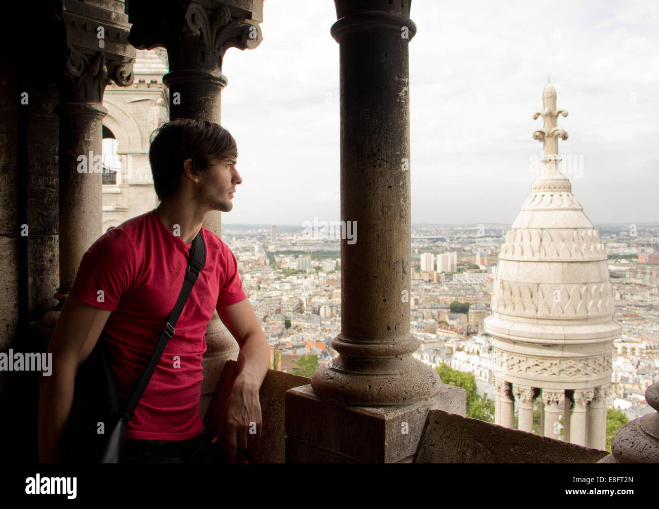 Man looking out over a city Stock Photo - Alamy