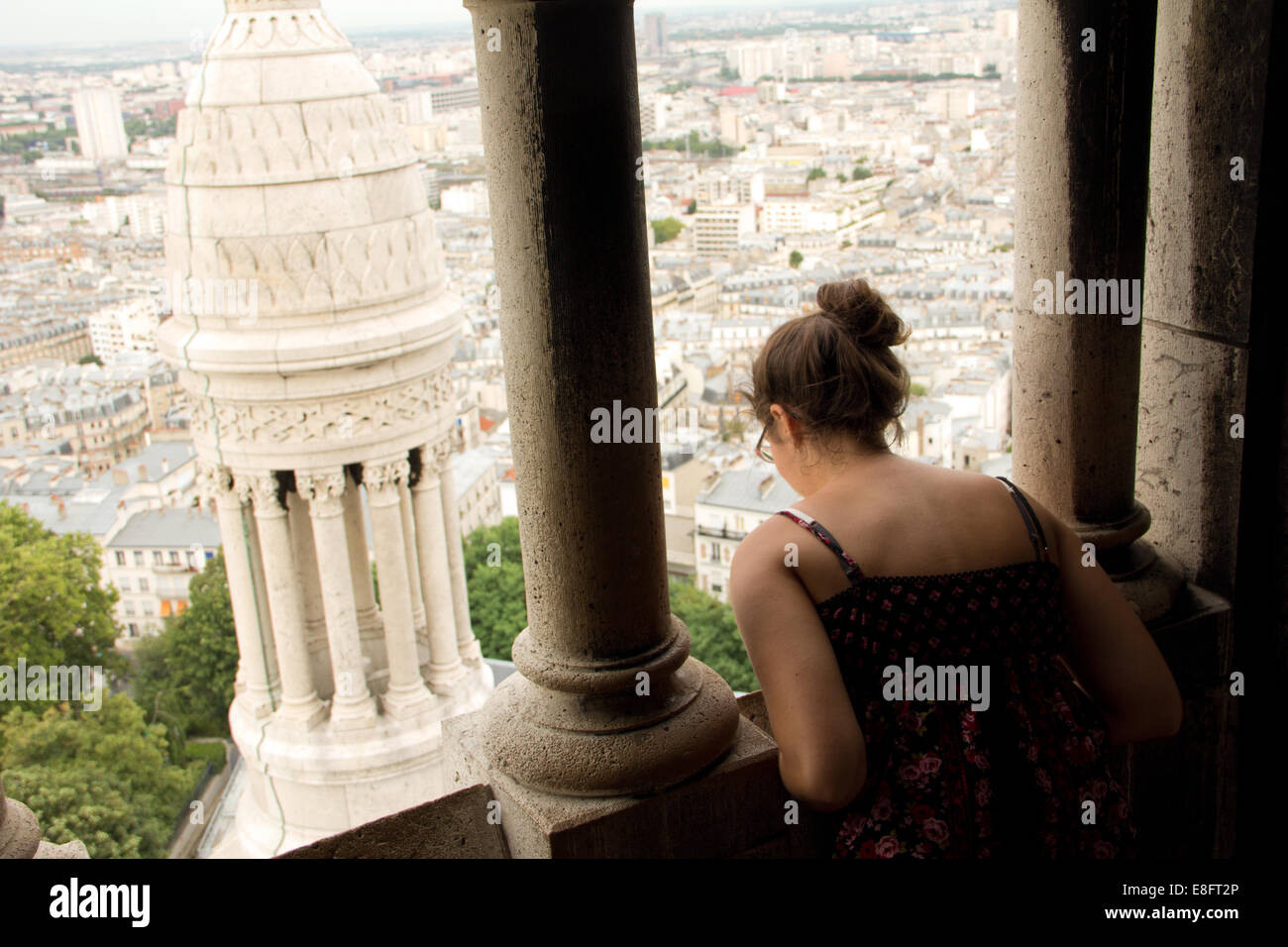 Woman looking out over city Stock Photo - Alamy