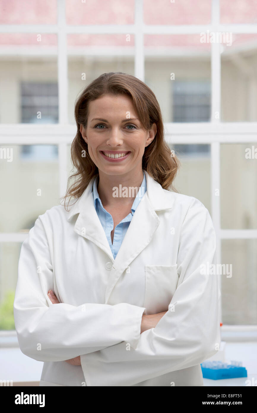 Technician smiling crossed arms hi-res stock photography and images - Alamy