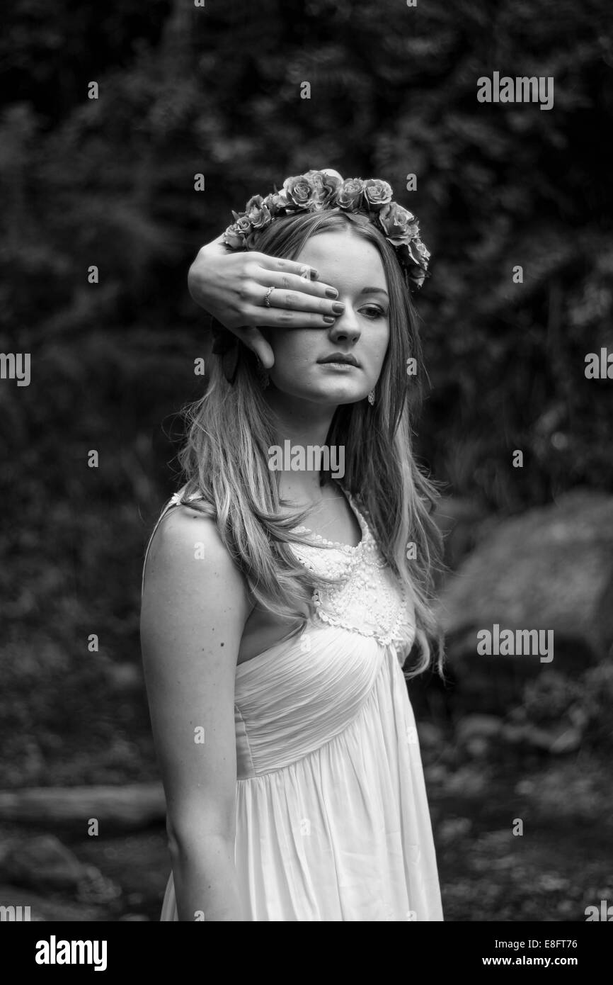 Woman covering one eye Stock Photo - Alamy