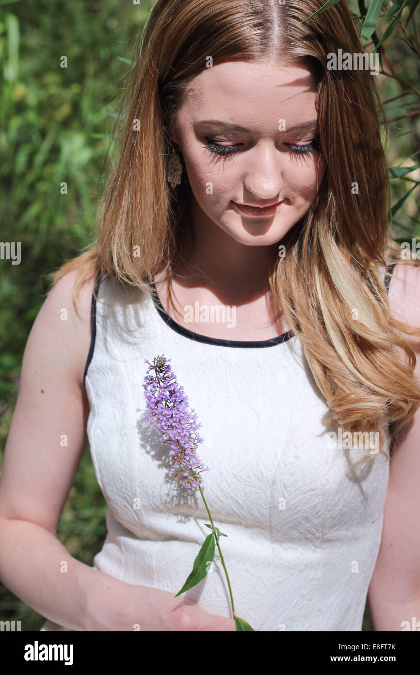Woman holding up flower hi-res stock photography and images - Alamy