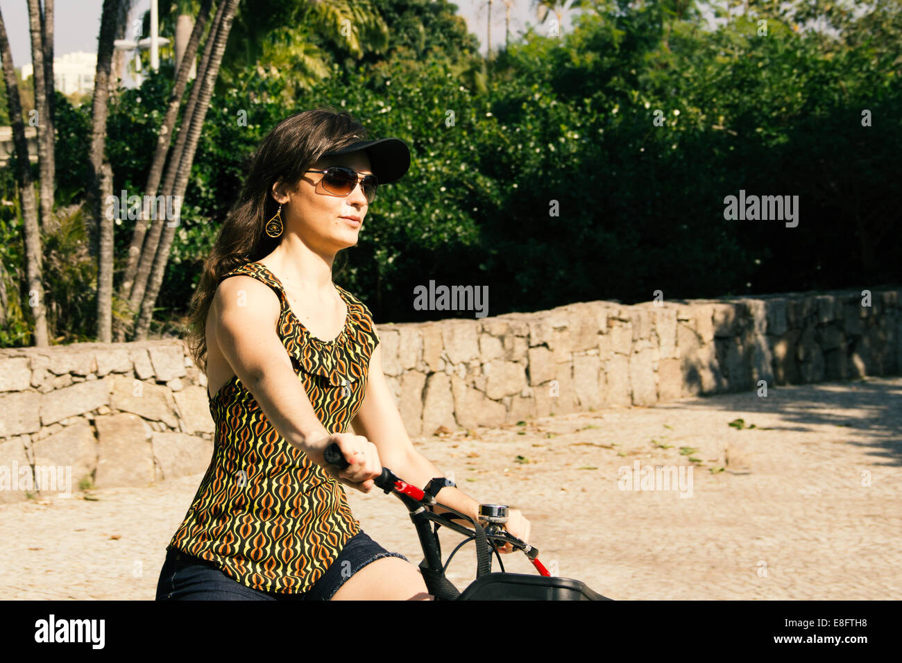 Woman on bicycle Stock Photo - Alamy