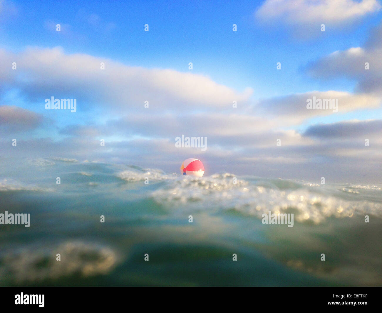 Beach ball floating in ocean, Orange County, California, United States ...