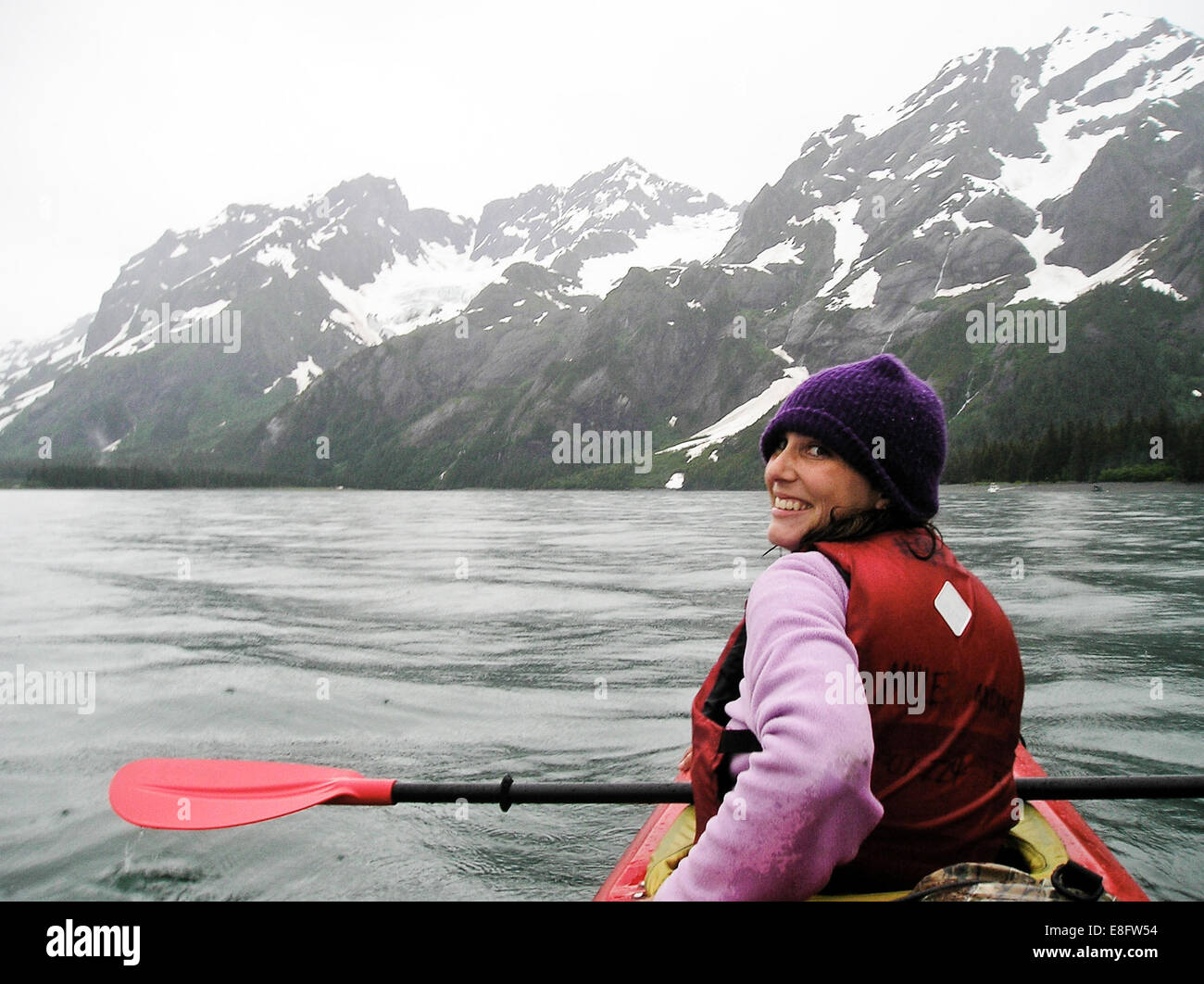 Woman kayaking near glaciers in kenai fjords national park hi-res stock ...