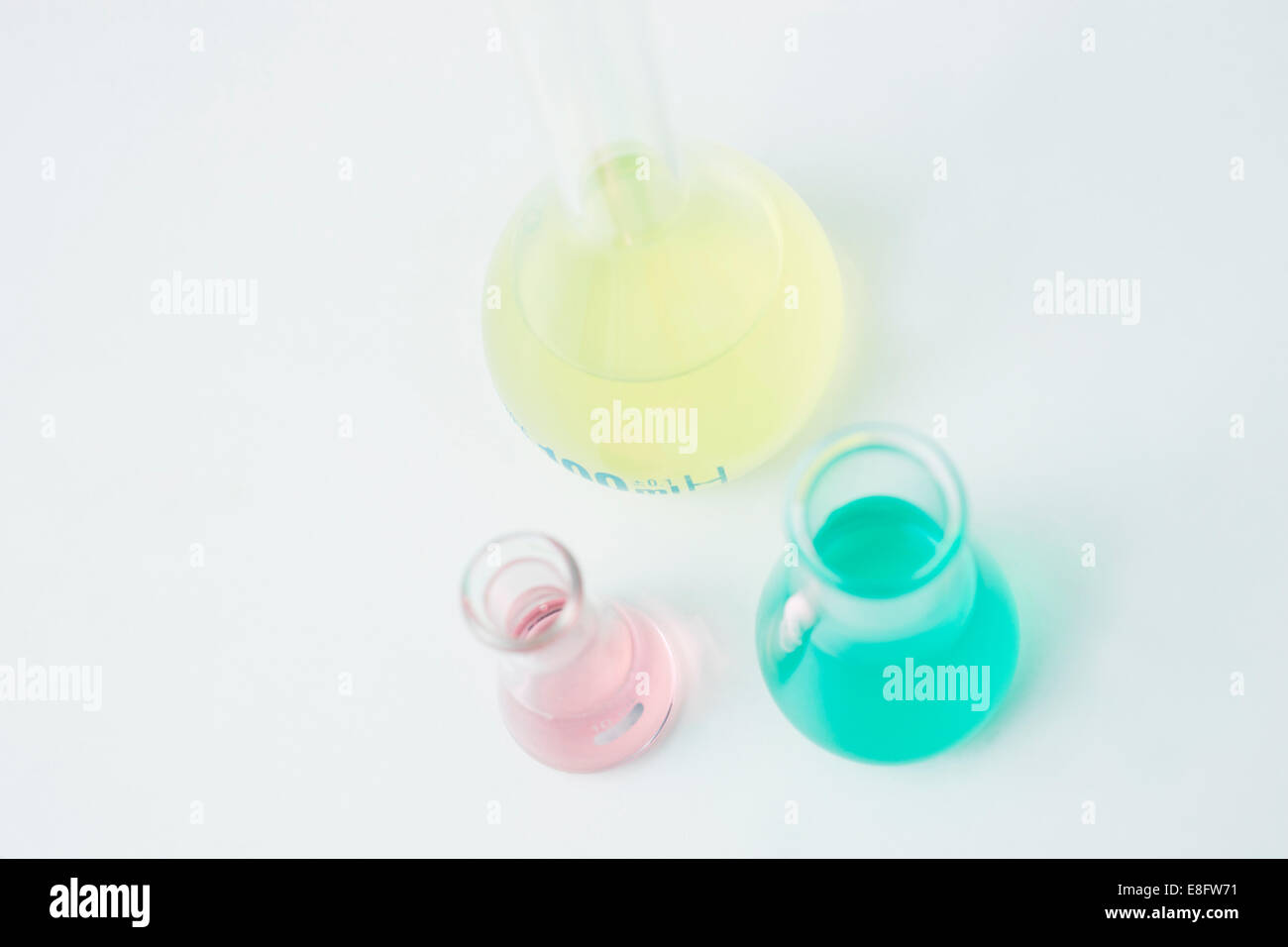 Three conical flasks and measuring beakers in research laboratory Stock ...