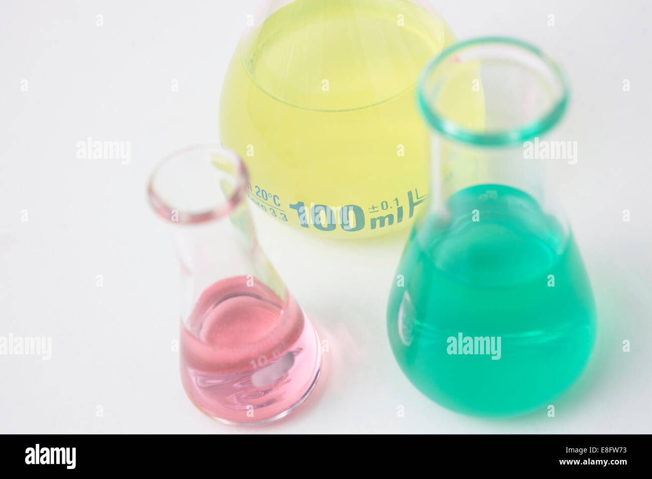 Three conical flasks and measuring beakers in research laboratory Stock ...