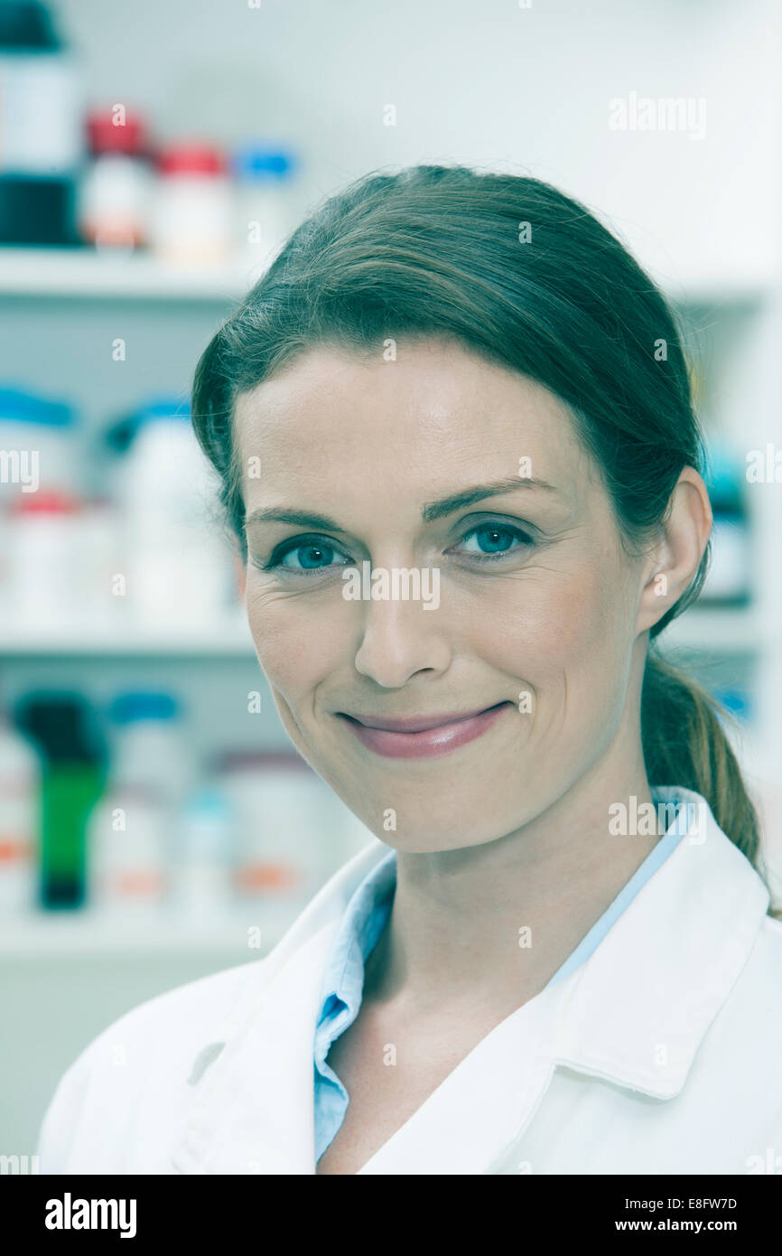 Portrait of a Smiling technician standing in laboratory Stock Photo - Alamy
