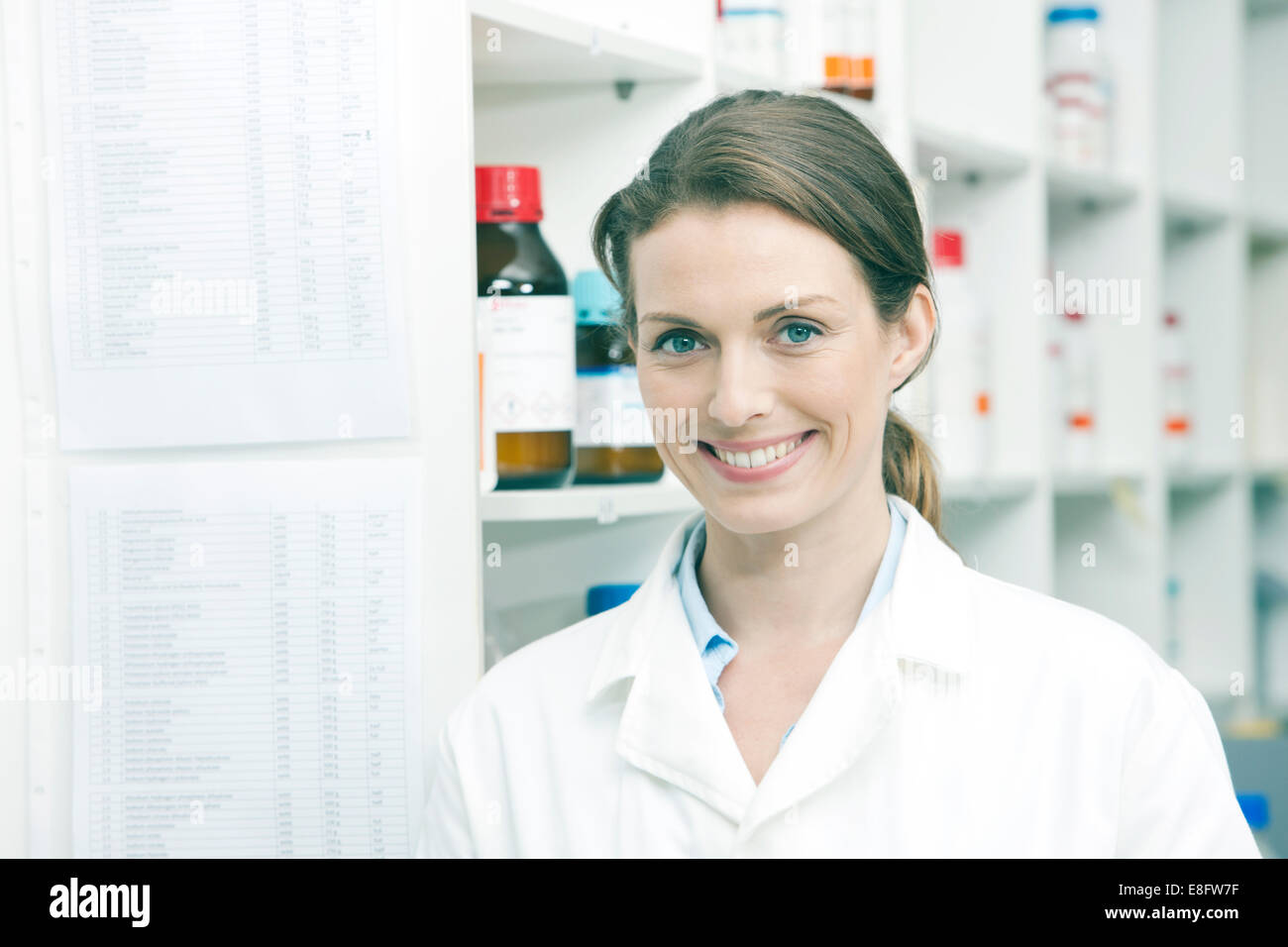 Portrait of a Smiling technician standing in laboratory Stock Photo - Alamy