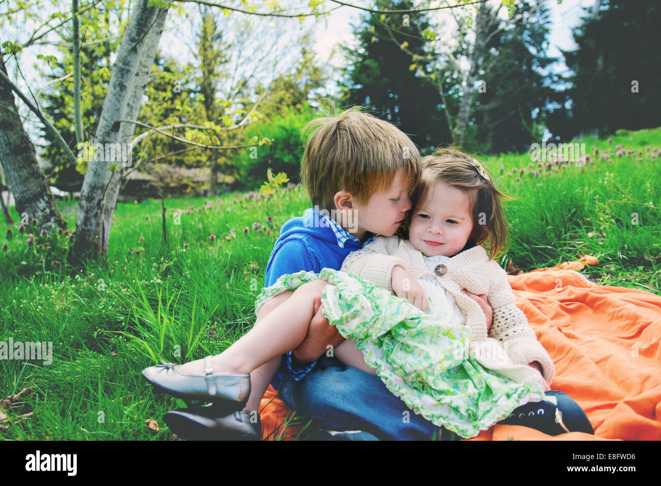 Boy cradling girl (2-3 years Stock Photo - Alamy