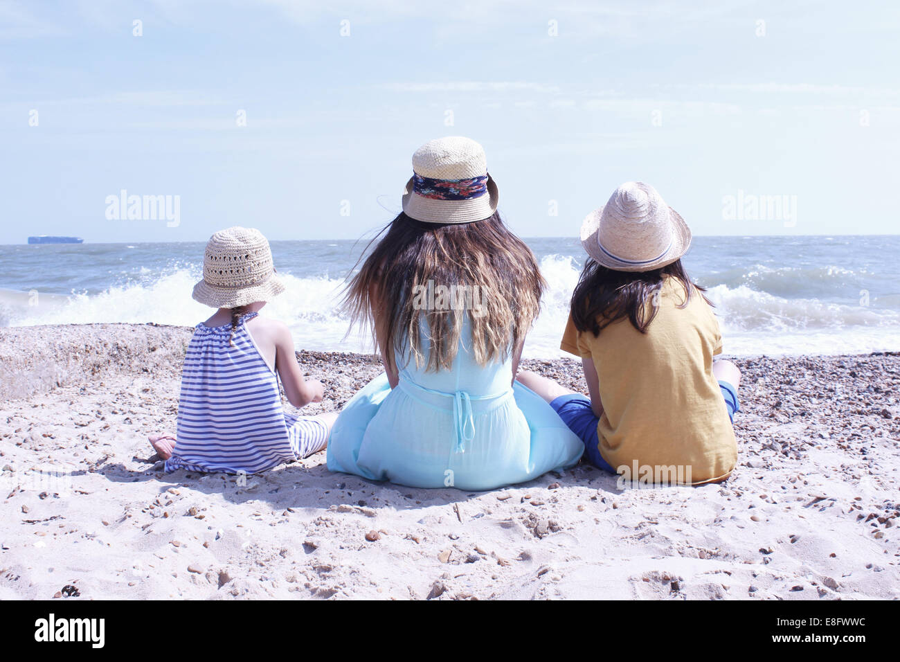 Child sitting on beach hi-res stock photography and images - Alamy