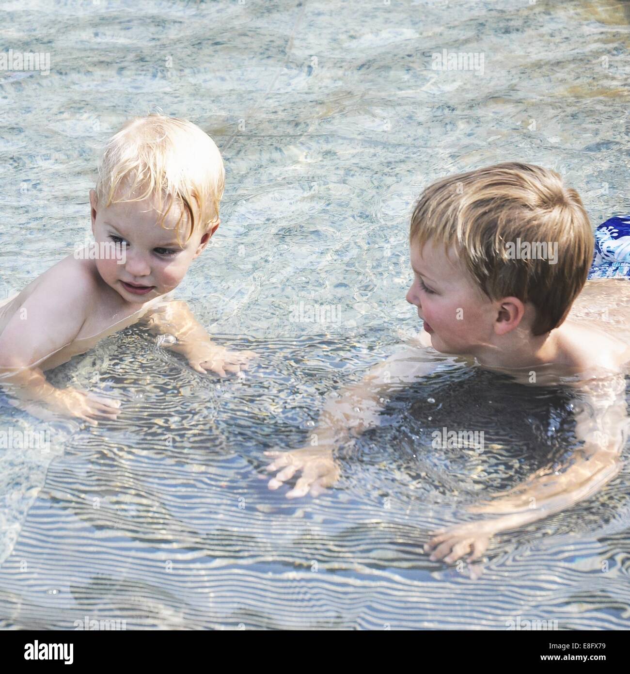 Boys in water Stock Photo - Alamy
