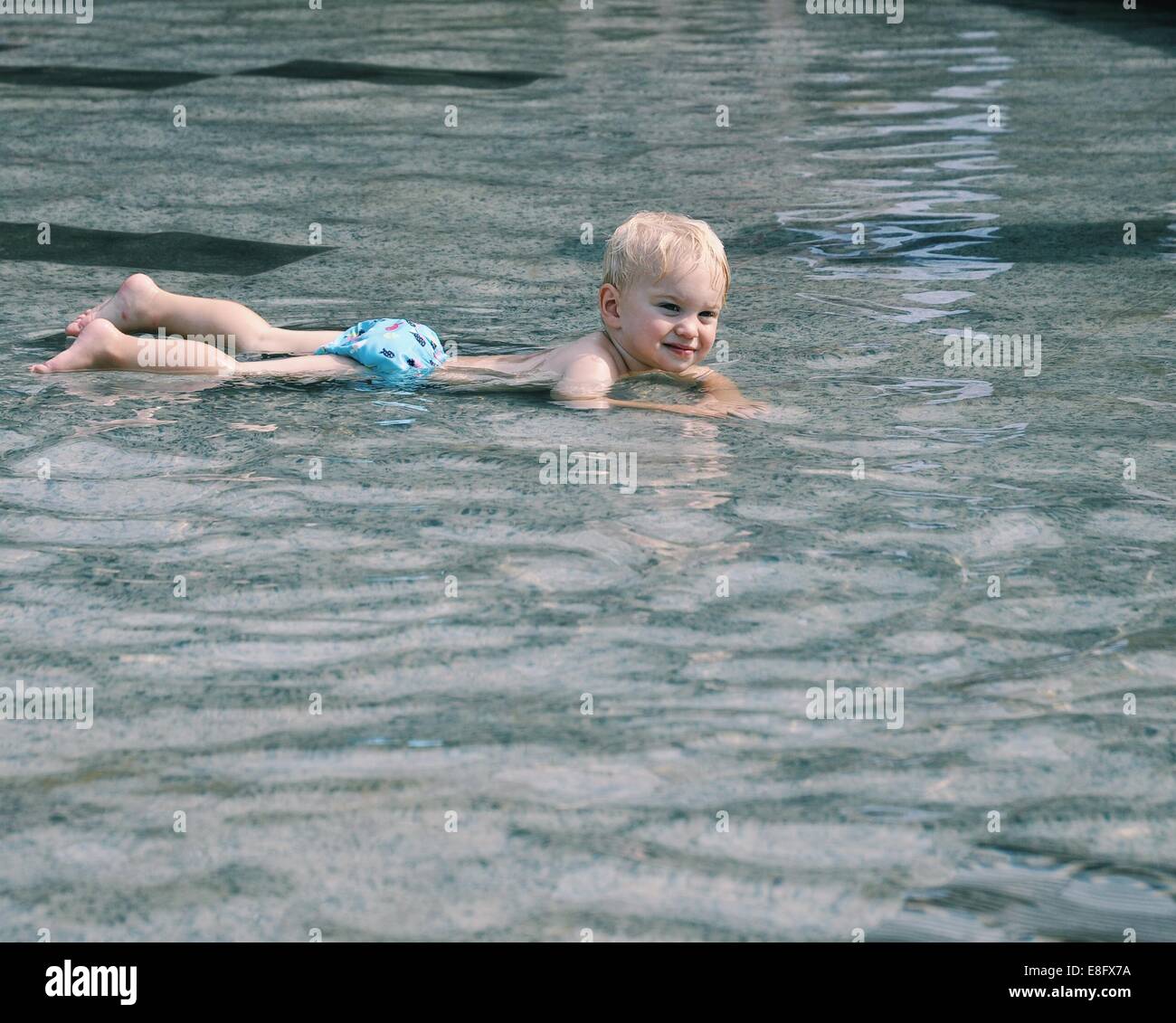 Lying by pool hi-res stock photography and images - Alamy