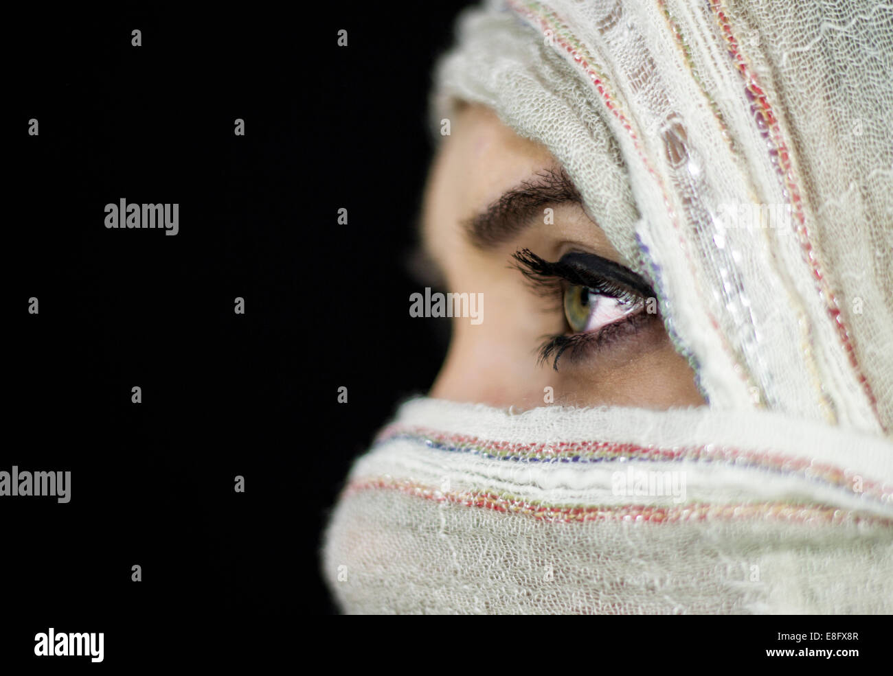 Portrait of a woman with her face covered Stock Photo - Alamy
