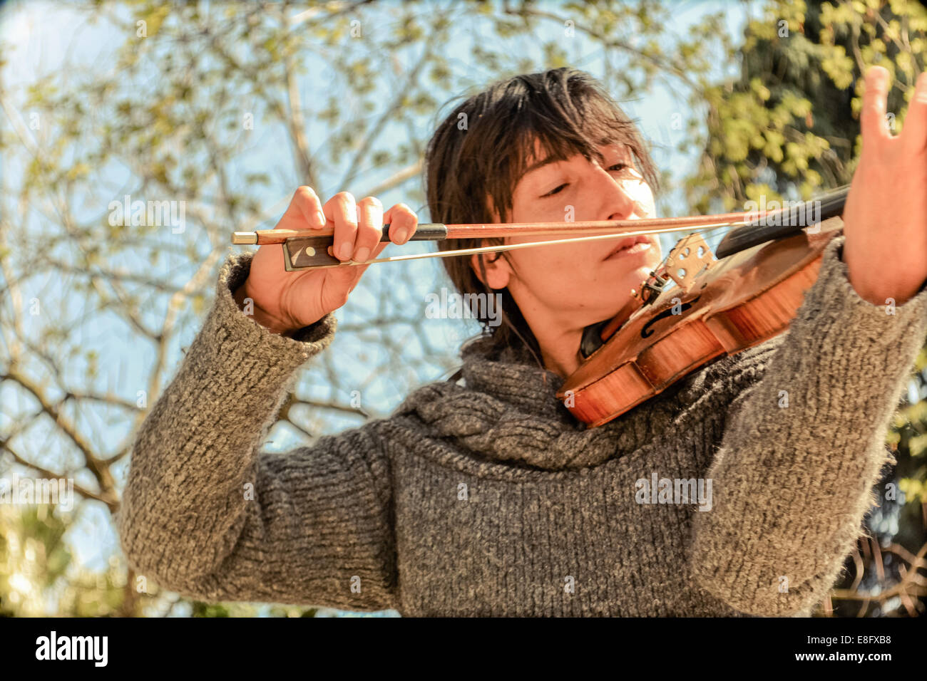 Albania, Tirana, Woman playing violin Stock Photo - Alamy