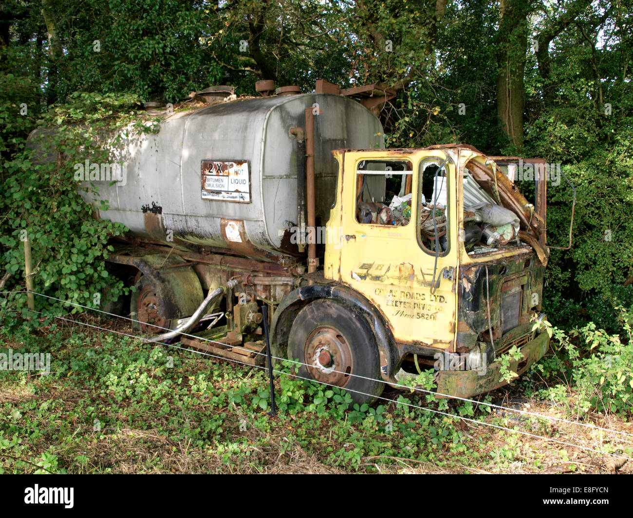 Overgrown lorry decaying in woodland, Devon, UK Stock Photo - Alamy