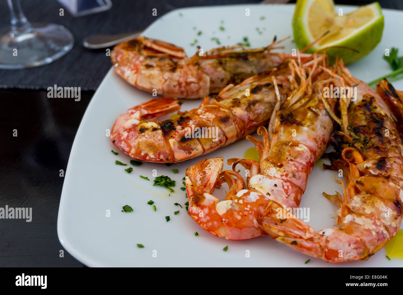 Giant grilled shrimp with lime dish Stock Photo - Alamy