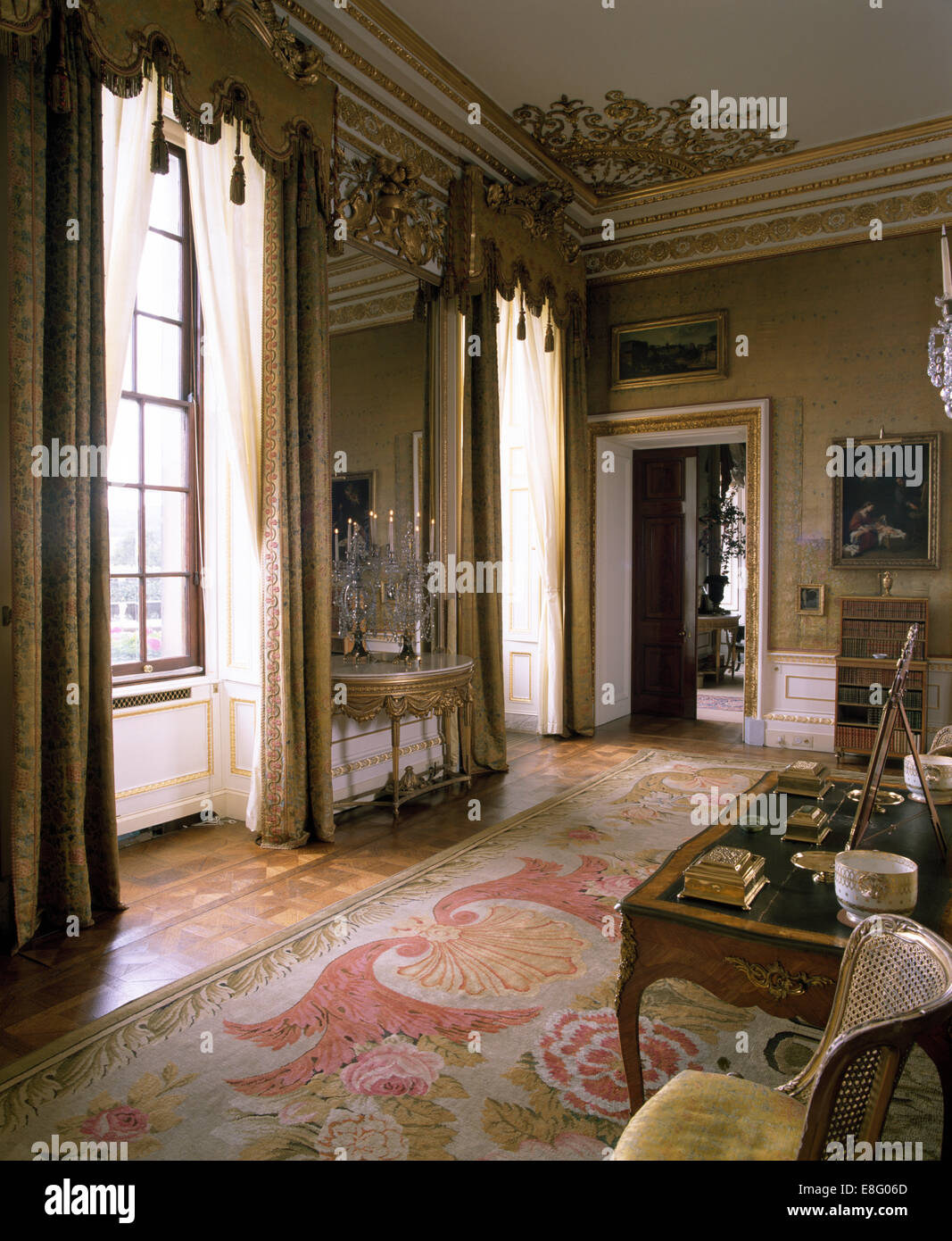 Ornate pelmets on tall windows in stately home drawing room with ...