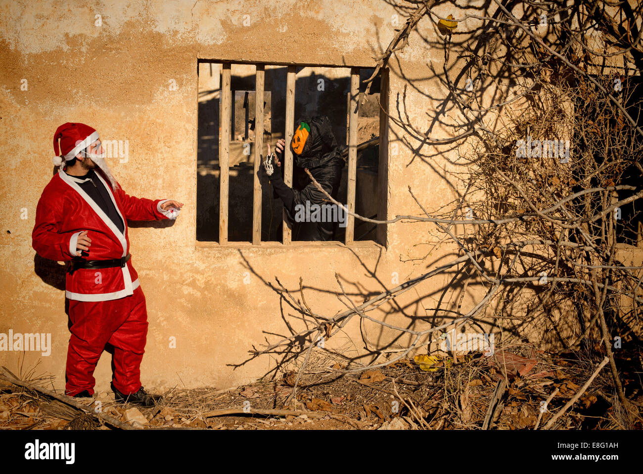 Halloween monster threatening Santa Claus from inside a ruin Stock ...