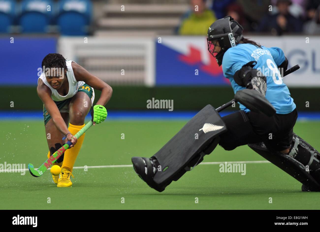 Sulette Damons (RSA) puts the ball past Sally Rutherford (NZL ...