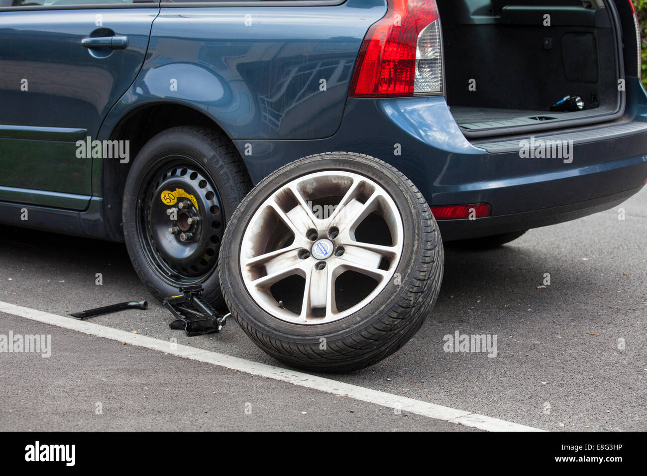 A temporary spare wheel fitted after flat tyre Stock Photo - Alamy