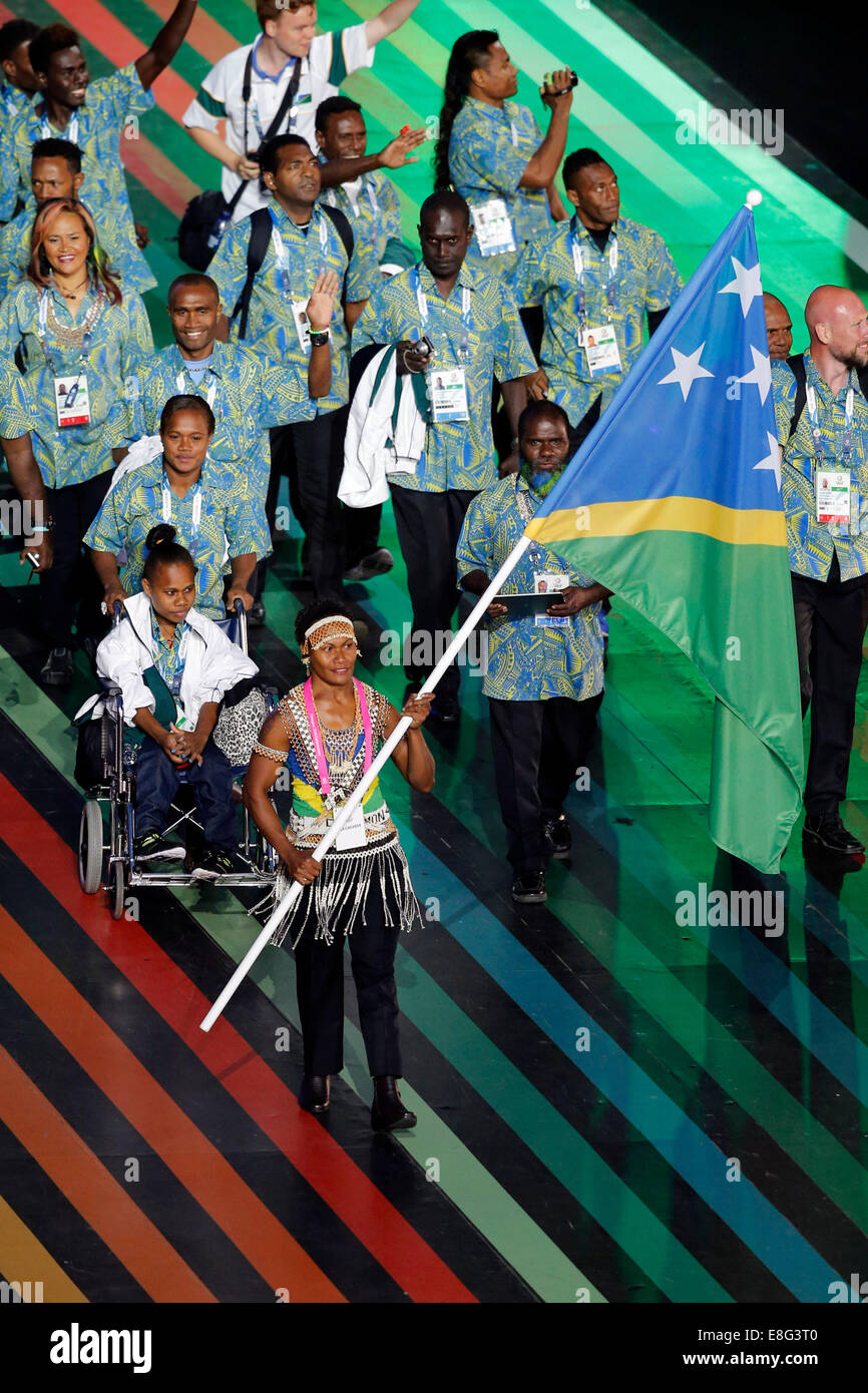 Flag bearer Jenly Tegu Wini leads in the Soloman Islands team. Opening ...