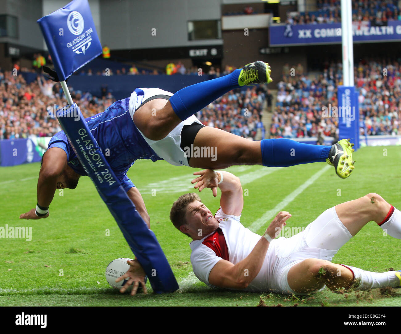 Lio Lolo (SAM) scores a try despite the efforts of Phillip Burgess (ENG ...