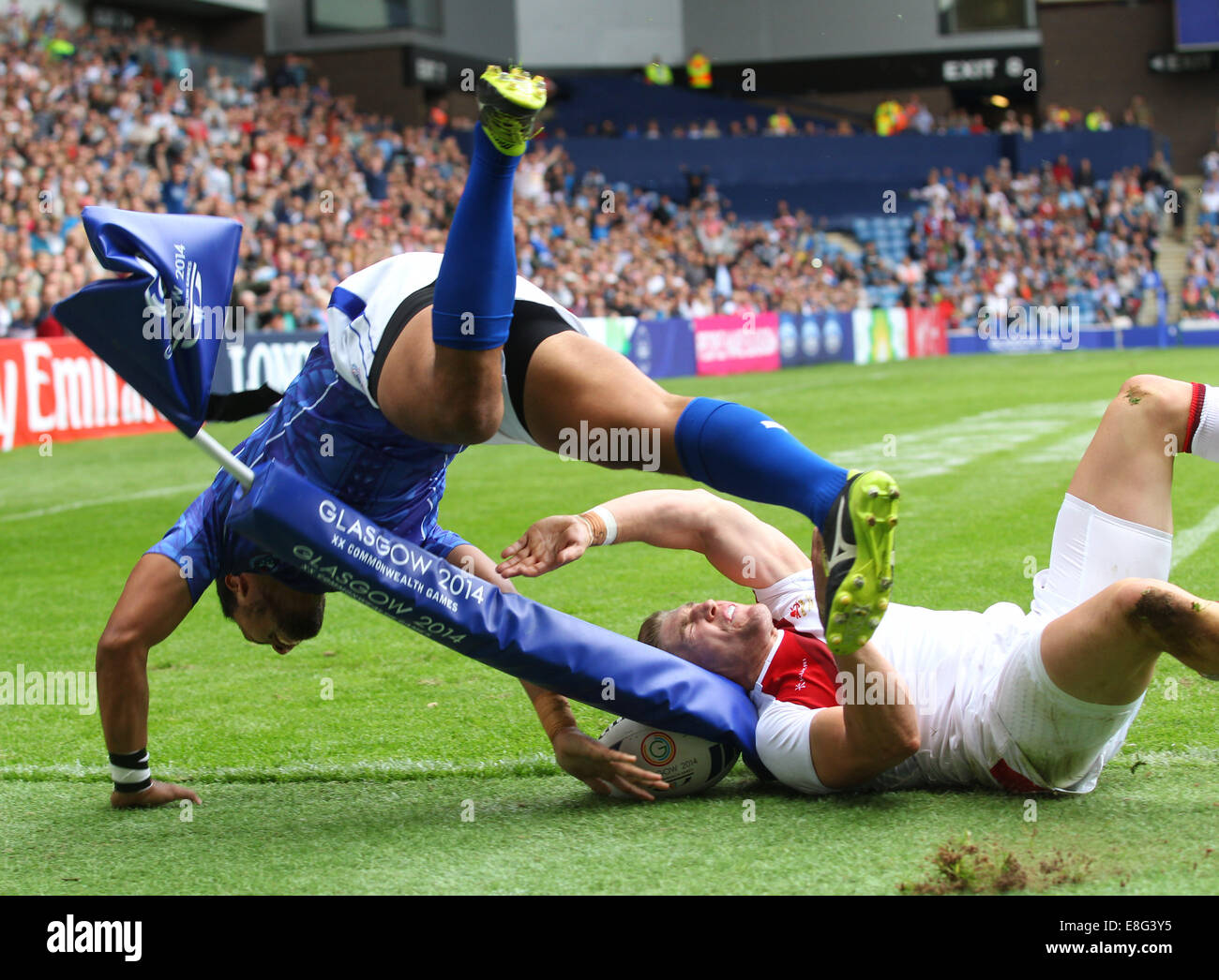 Lio Lolo (SAM) scores a try despite the efforts of Phillip Burgess (ENG ...