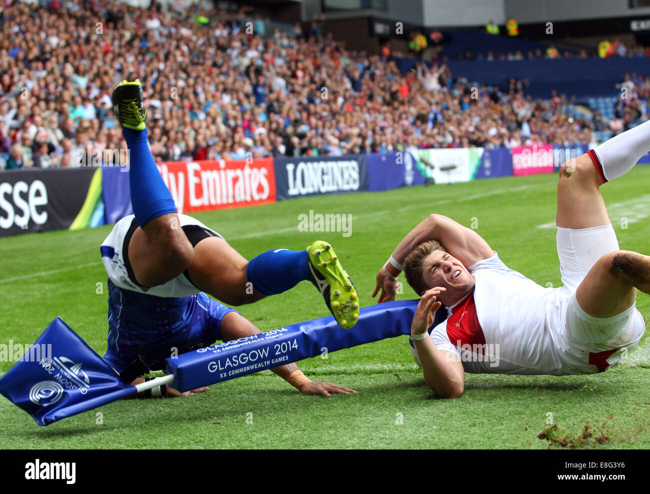Lio Lolo (SAM) scores a try despite the efforts of Phillip Burgess (ENG ...