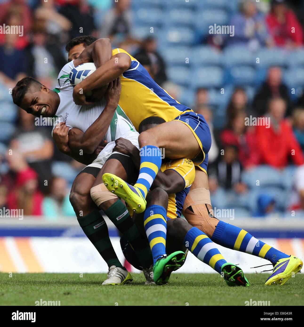 Richard Dharmapala (SRI) is tackled by Nicholas Jackman (BAR) and ...
