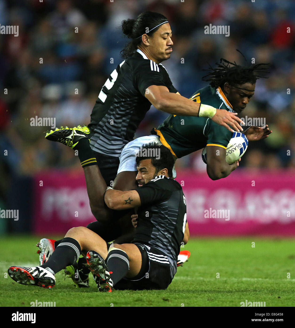 Ben Lam (NZL) and Sherwin Stowers (NZL) combine to tackle Seabelo ...