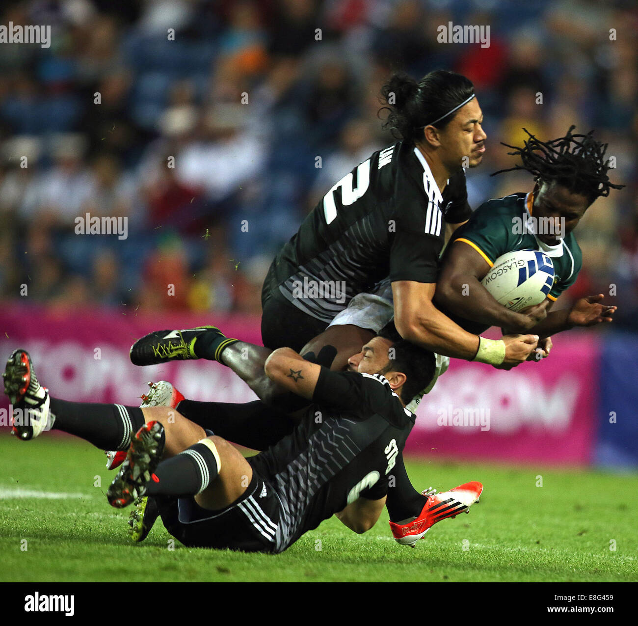 Ben Lam (NZL) and Sherwin Stowers (NZL) combine to tackle Seabelo ...