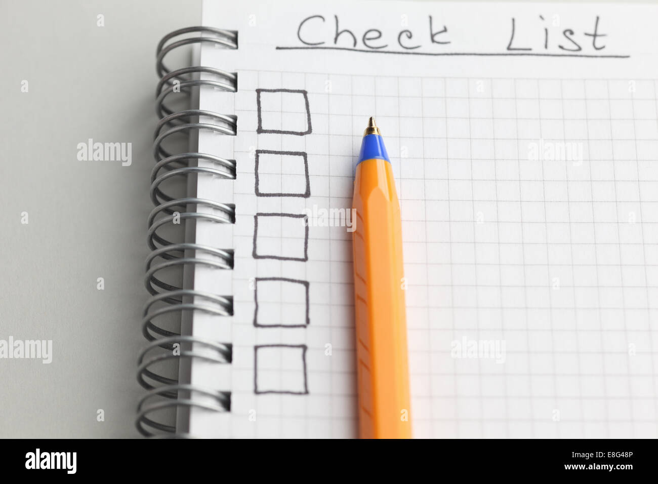 Checklist with ballpoint pen. Close-up Stock Photo - Alamy