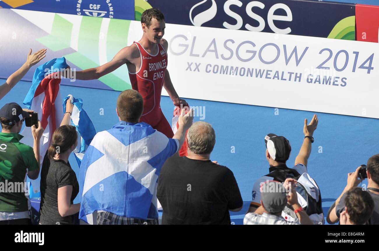 Alistair Brownlee (ENG) collects a Yorkshire flag from the crowd ...