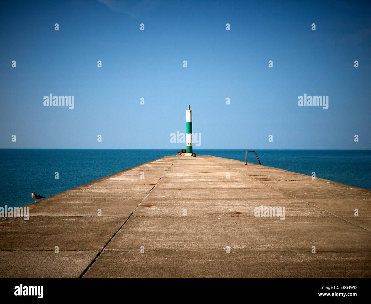 Stone jetty with beacon in Aberystwyth Ceredigion Wales UK Stock Photo ...