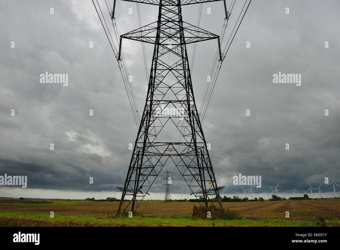 Onshore wind farm turbines and electricity pylons at Little Cheyne ...
