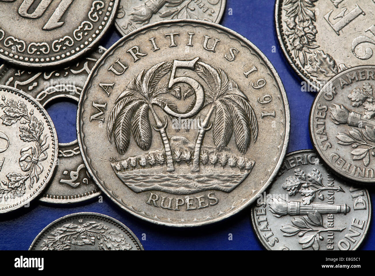 Coins of Mauritius. Two palm trees depicted in the Mauritian five rupee ...