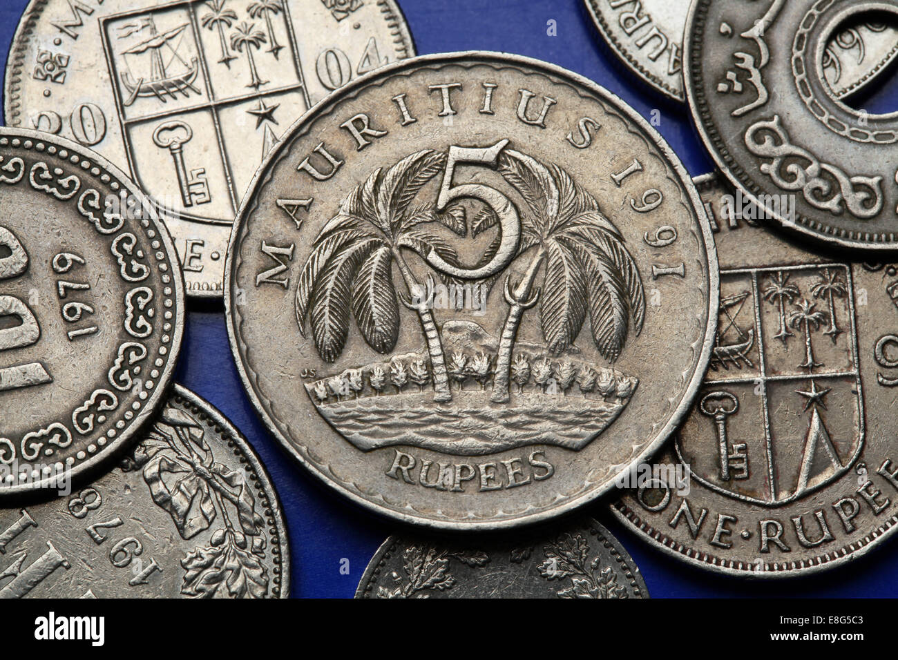 Coins of Mauritius. Two palm trees depicted in the Mauritian five rupee ...