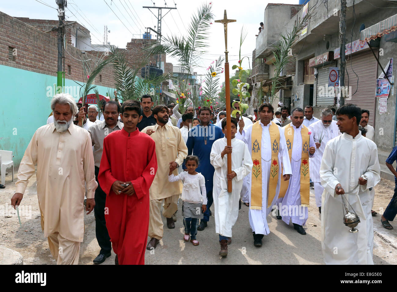 Catholic christian pilgrims march during the Palm Sunday procession ...