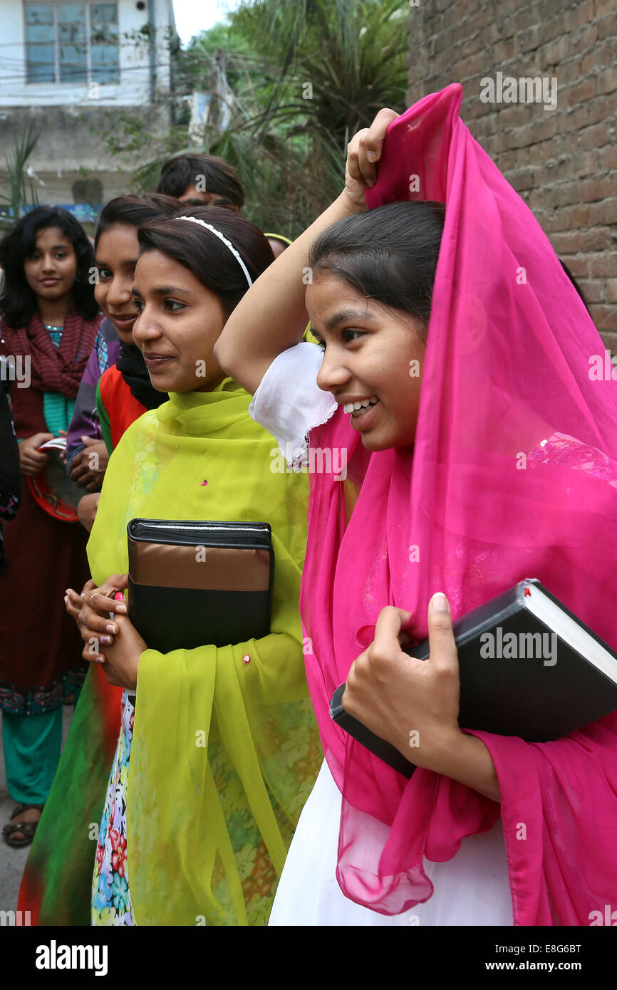 Christian women march during the Palm Sunday procession through the ...